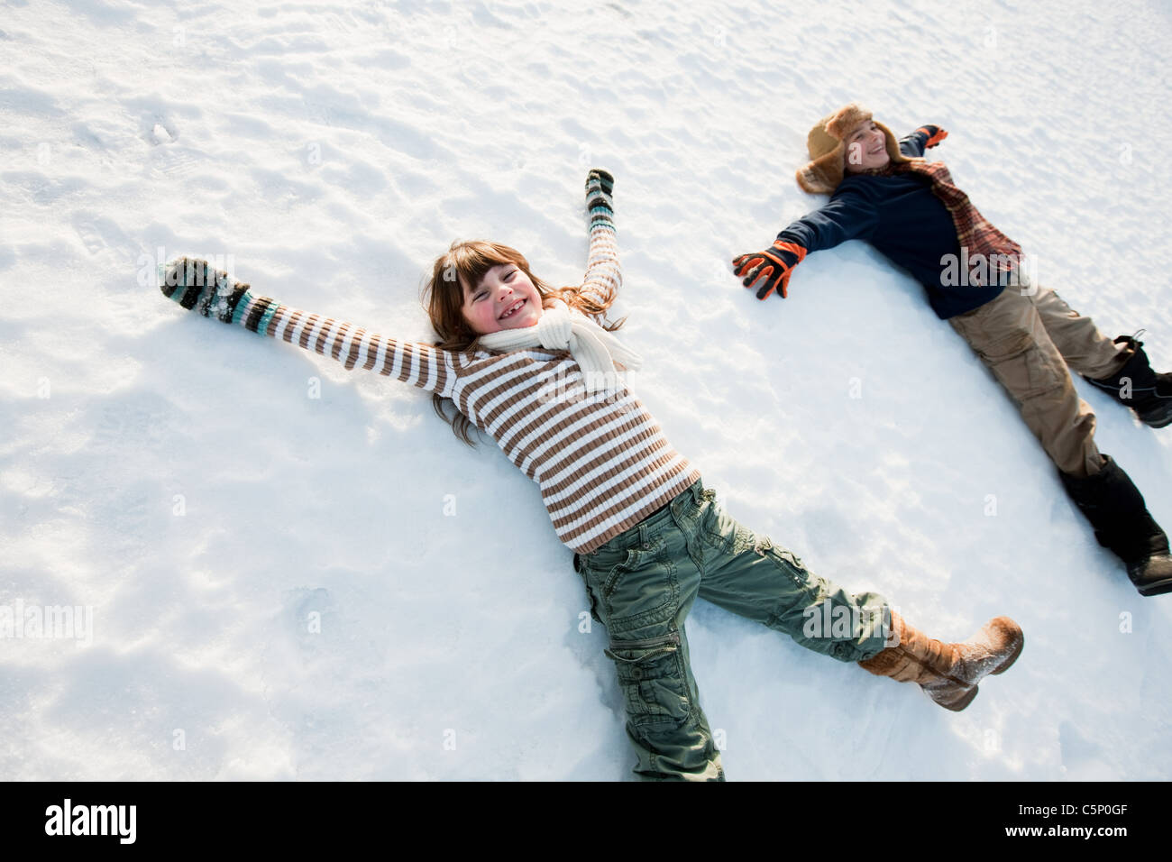 Children making snow angels hi-res stock photography and images - Alamy