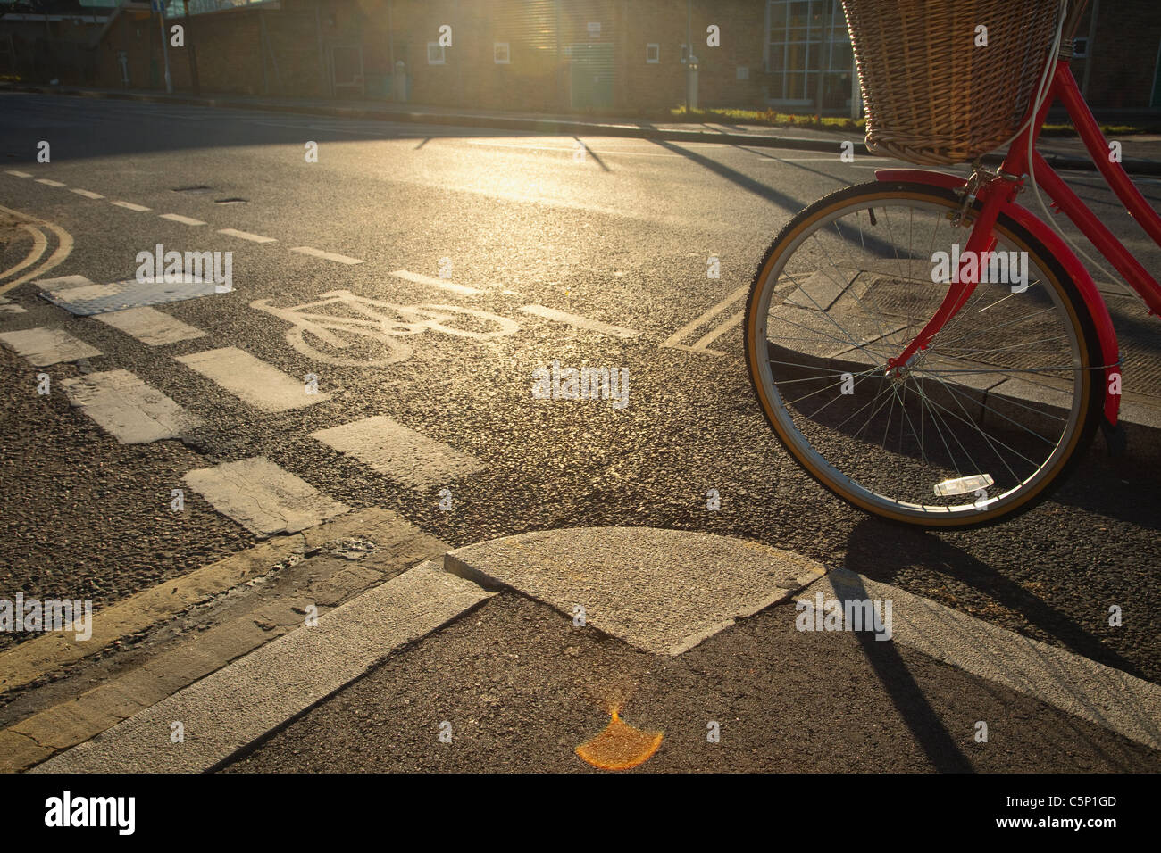 Road with cycle path and bicycle Stock Photo - Alamy