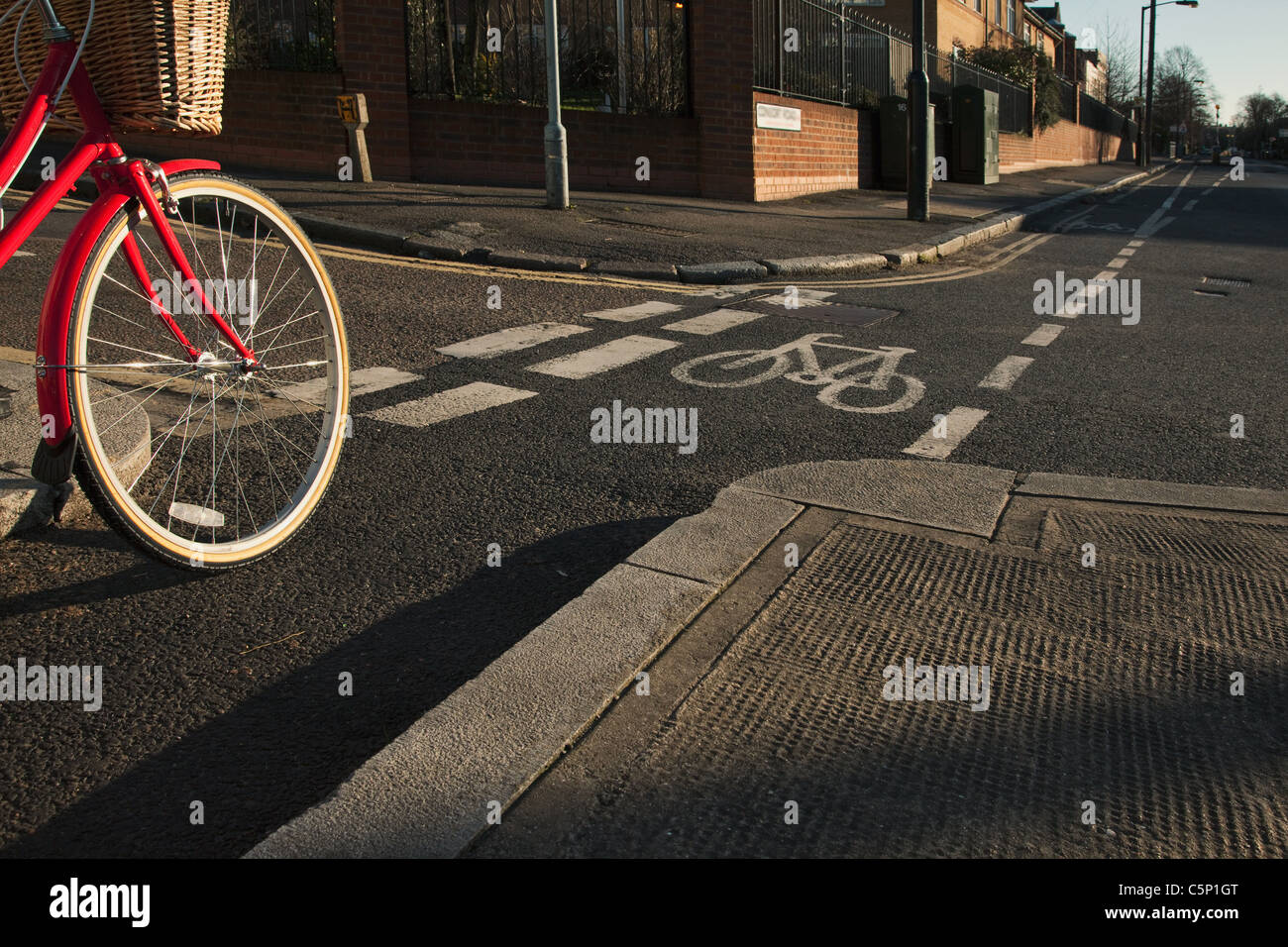 Road with cycle path and bicycle Stock Photo - Alamy