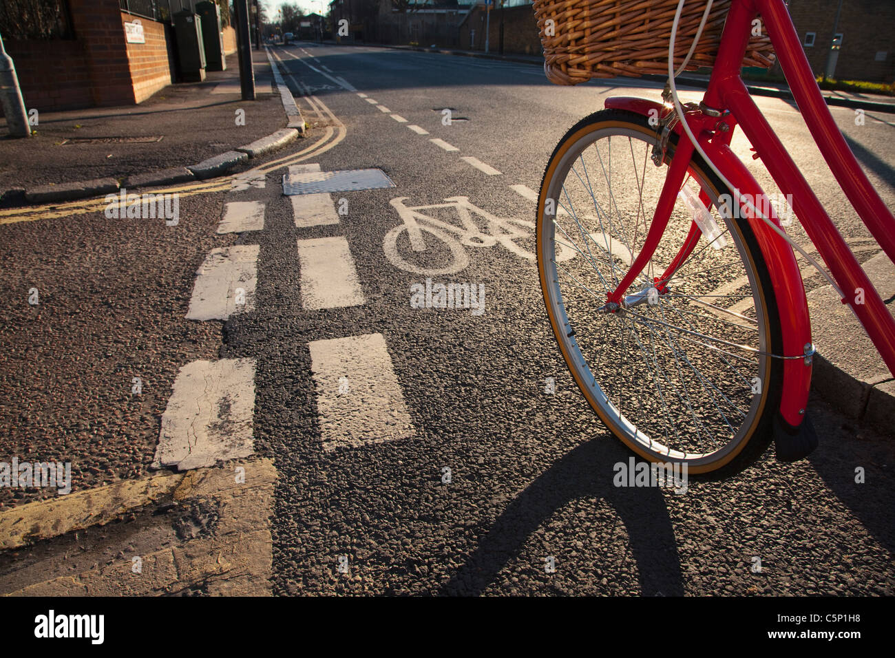 Road with cycle path and bicycle Stock Photo - Alamy