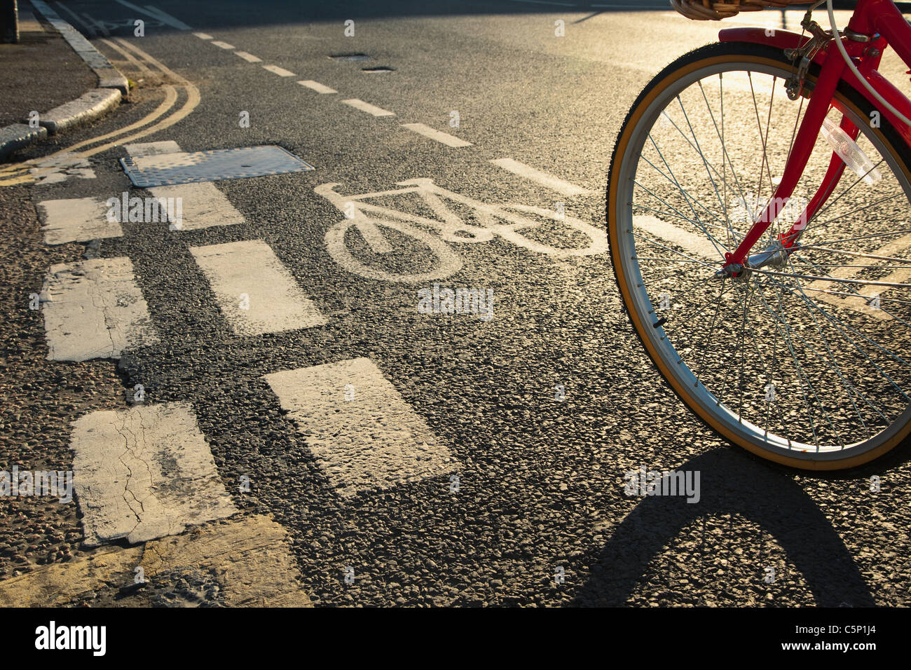 Road with cycle path and bicycle Stock Photo - Alamy