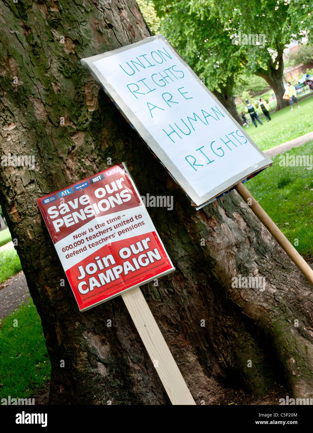 Placards leaning against a tree in Belmont Park Stock Photo - Alamy