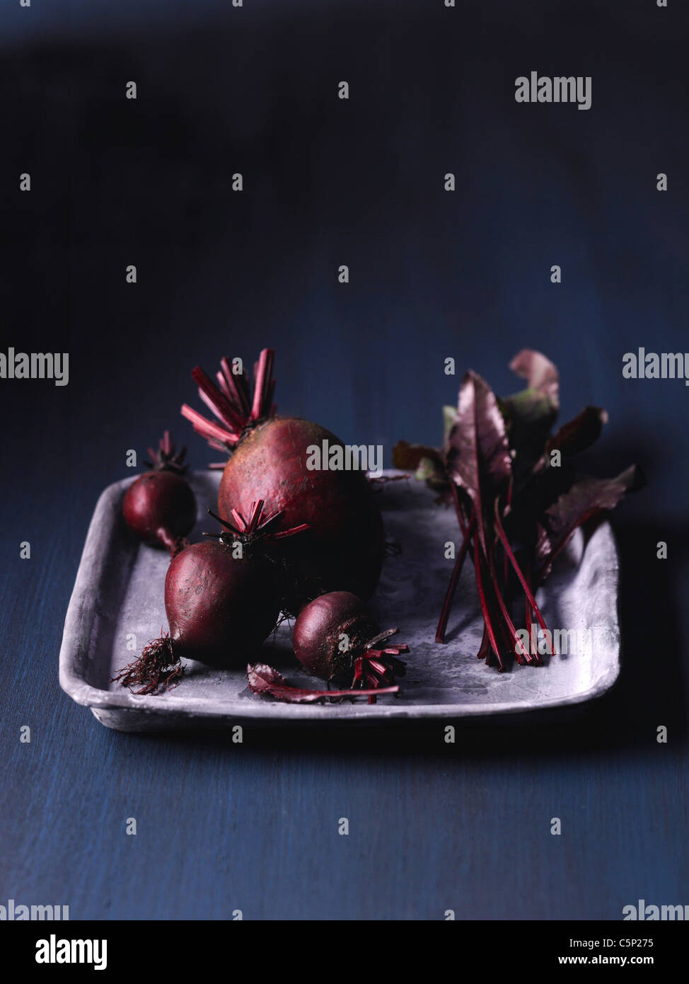 Beetroot bulb with roots and leaves Stock Photo - Alamy