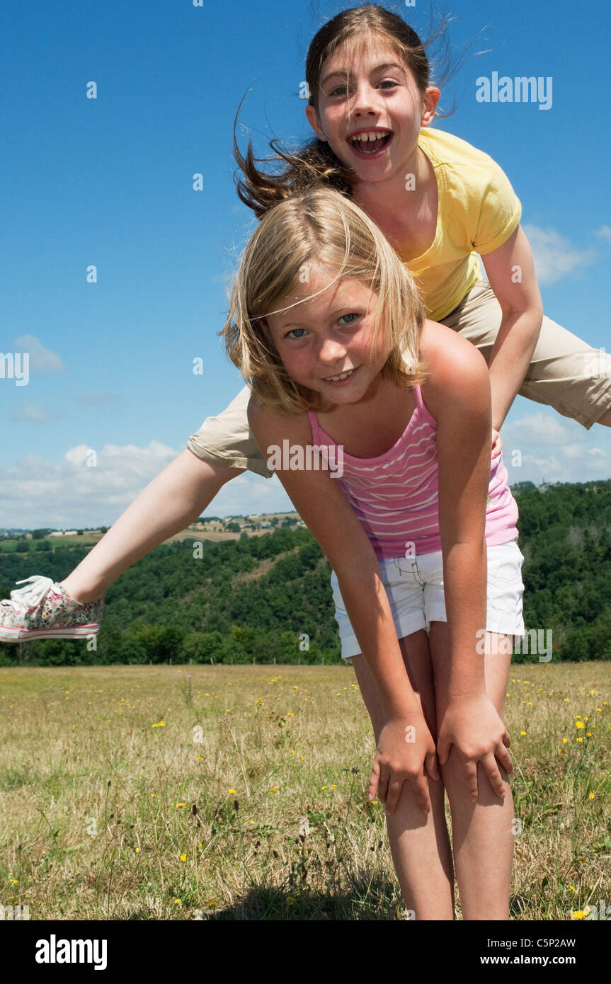Two children playing leapfrog hi-res stock photography and images - Alamy