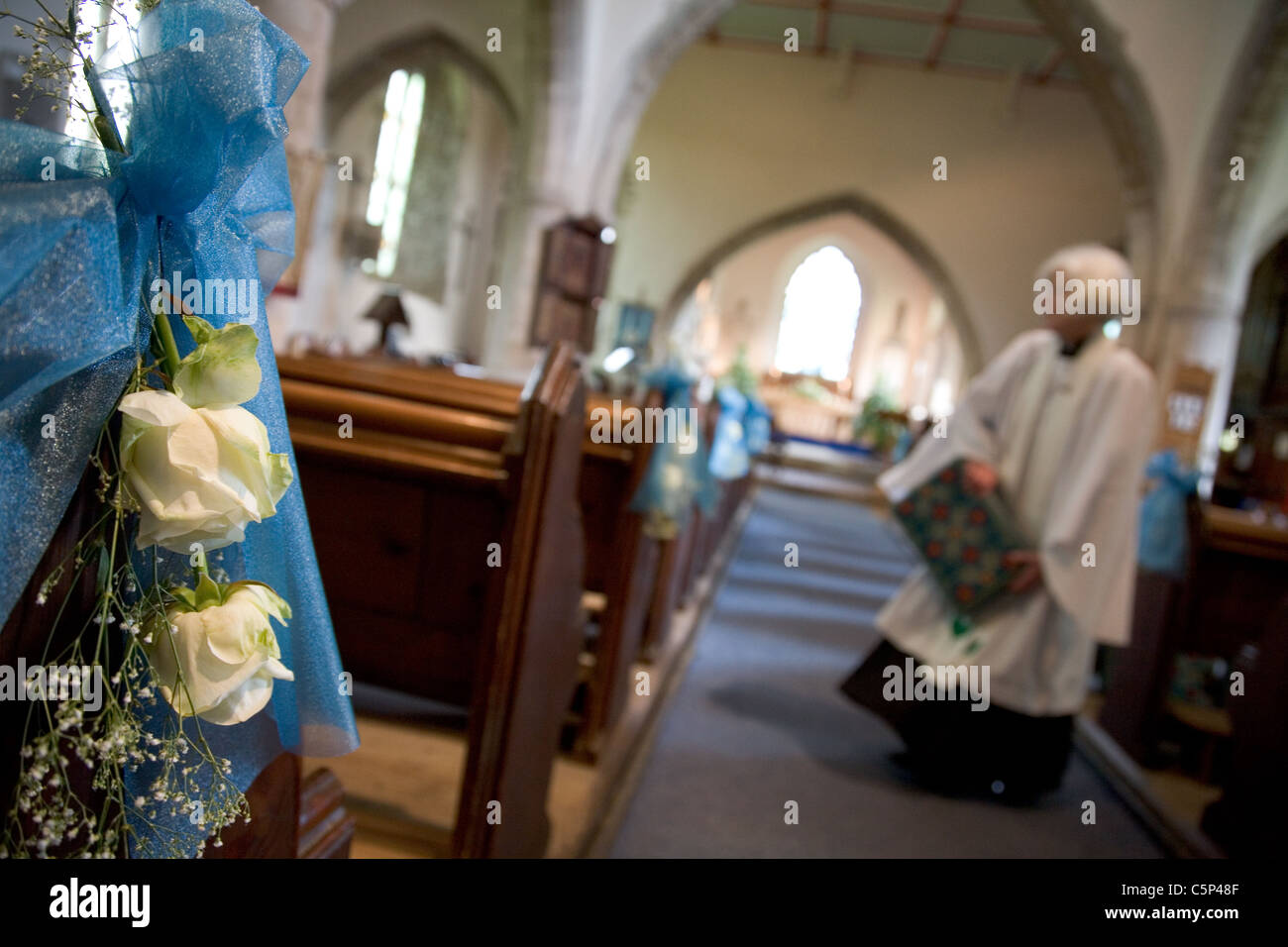 female vicar checking the church before a wedding Stock Photo - Alamy