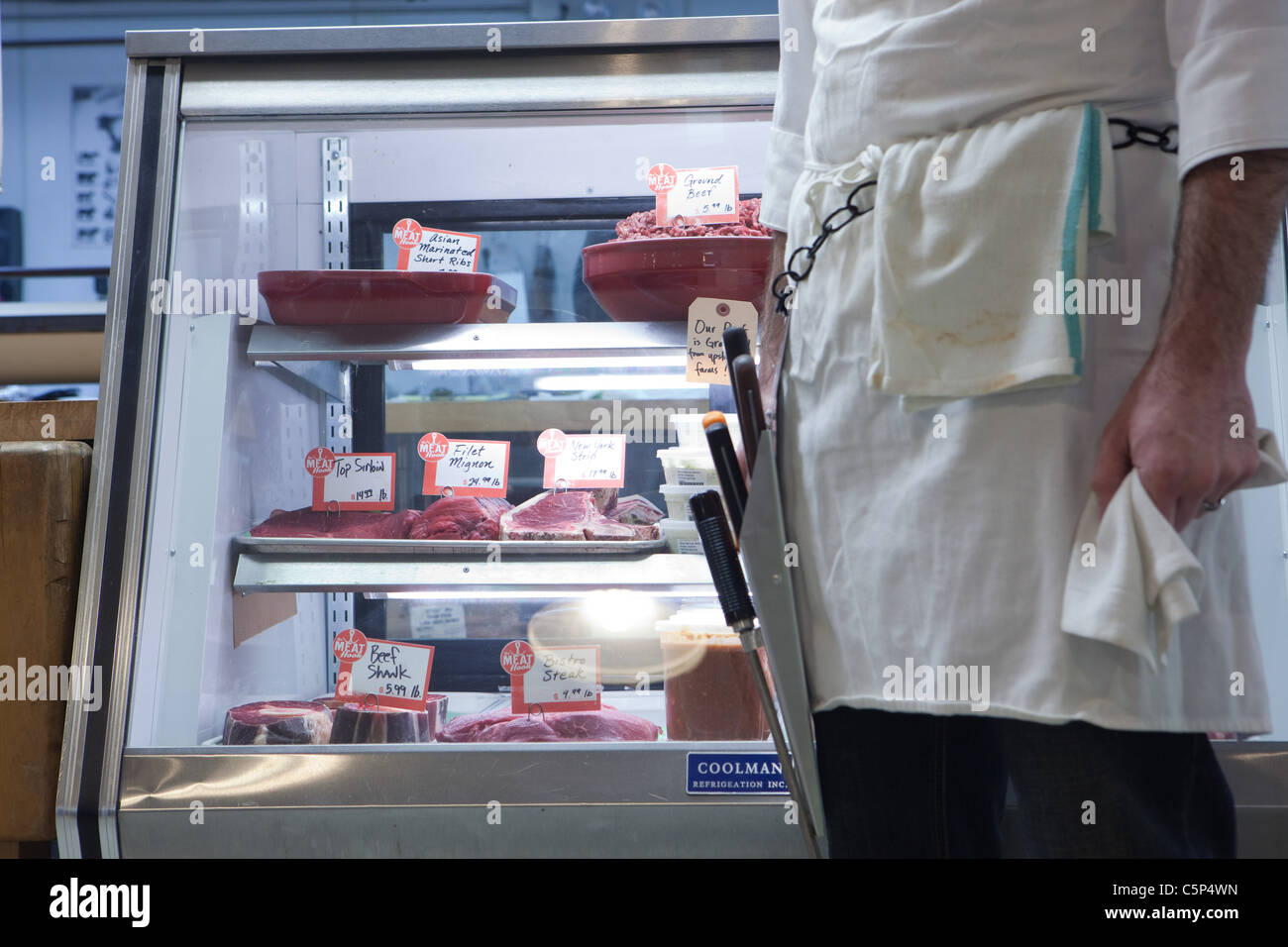 Butcher in shop Stock Photo - Alamy