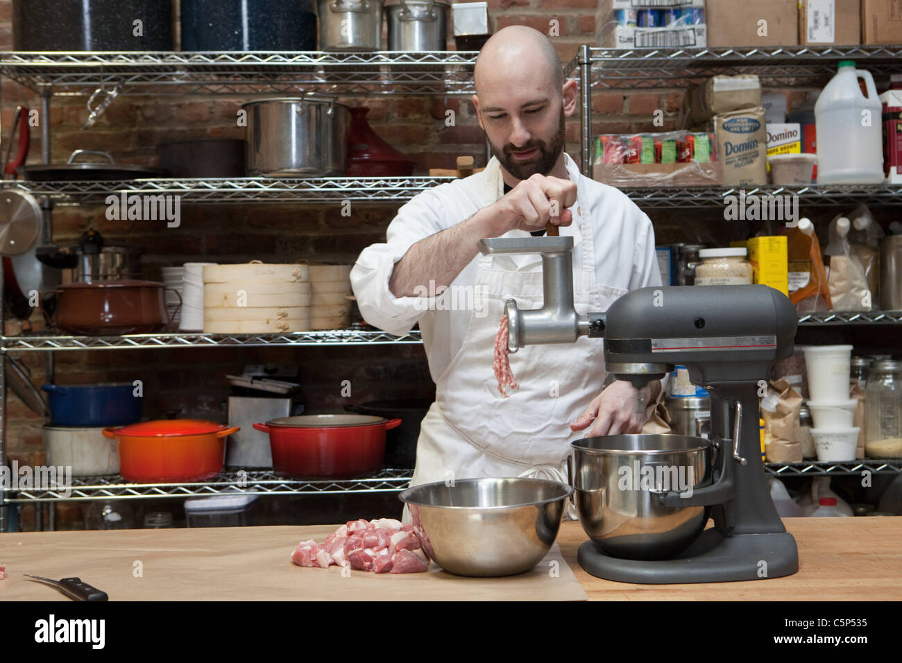 Butcher making ground meat Stock Photo - Alamy