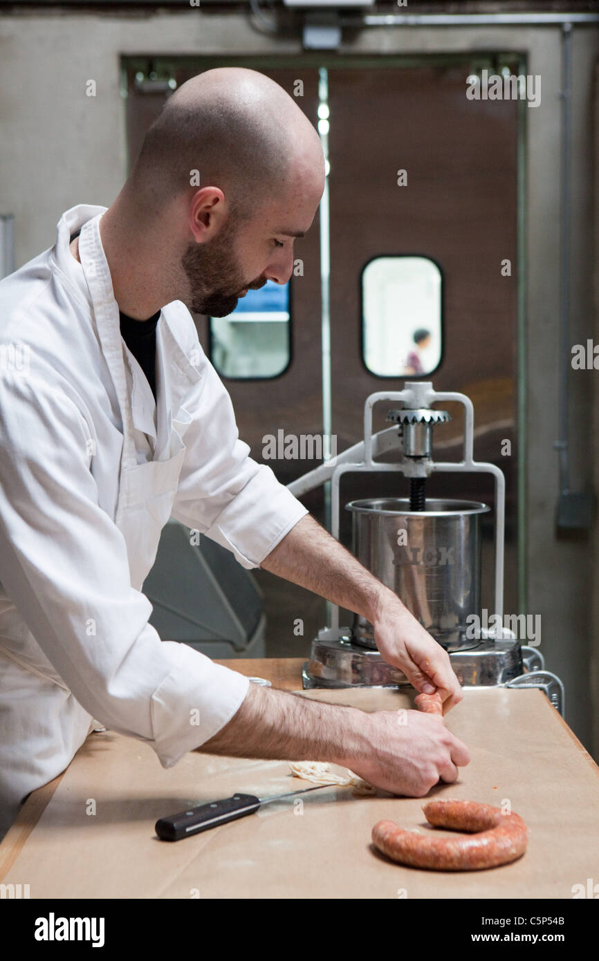 Butcher making sausages Stock Photo - Alamy