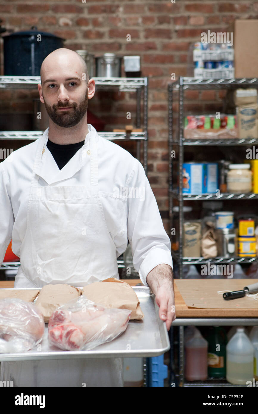 Butcher with tray of meat Stock Photo - Alamy