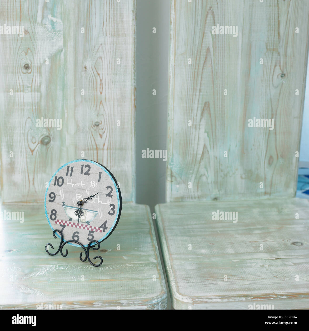 A clock on chair Stock Photo - Alamy