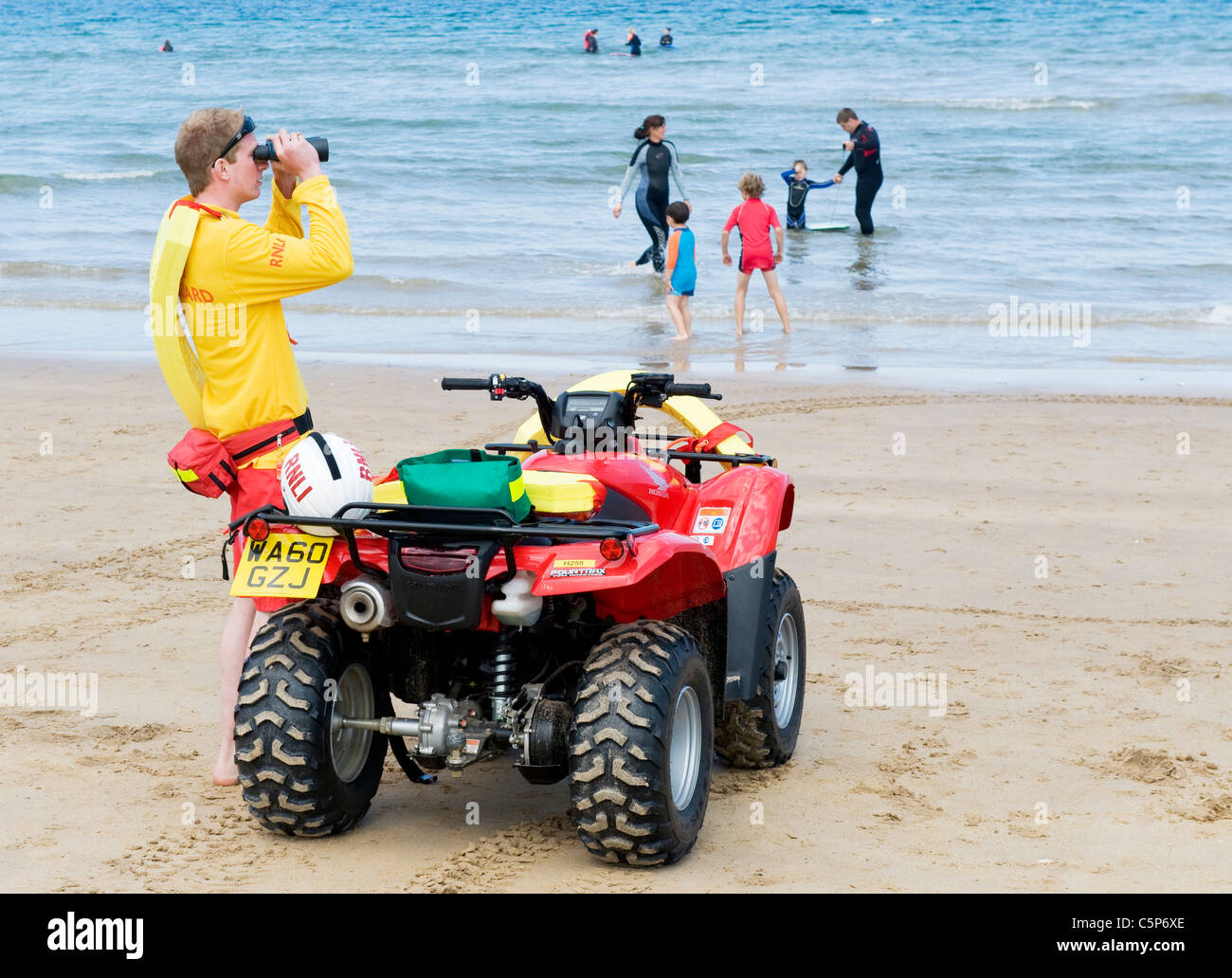 The White Rocks beach in Portrush, Northern Ireland. lifeguard with a ...