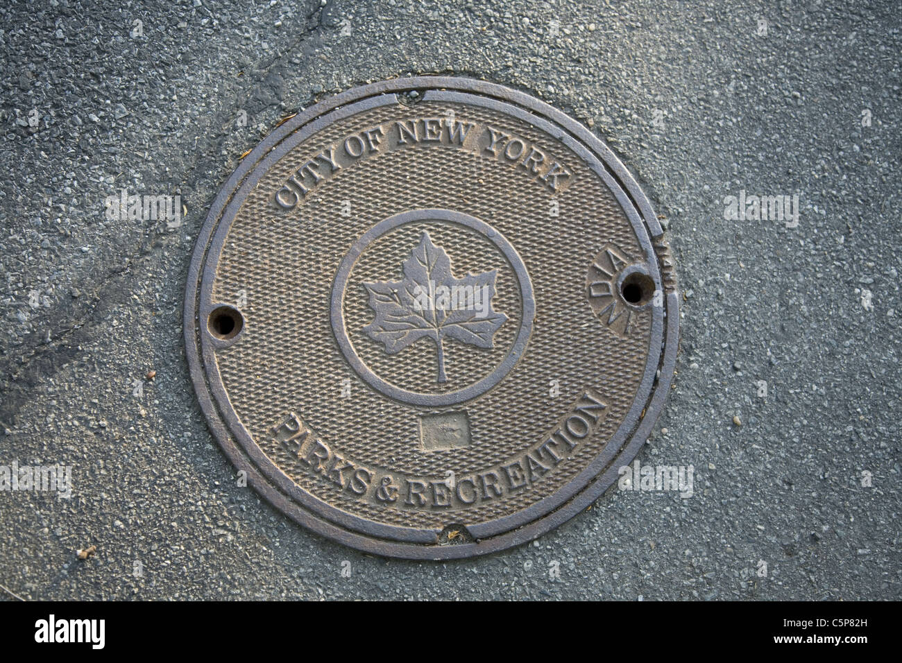 Manhole cover made in India on a road in Prospect Park, Brooklyn, NY ...