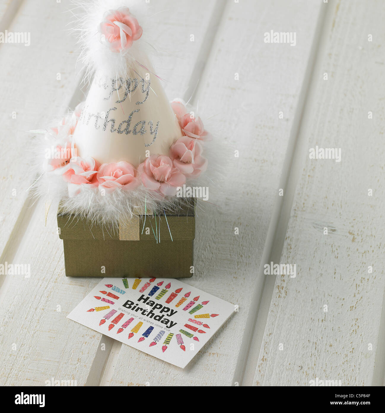 A present, party hat and birthday card Stock Photo - Alamy