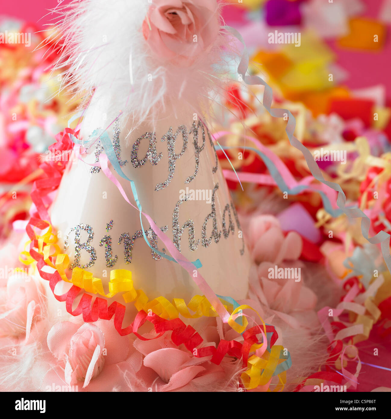 A party hat with many ribbons Stock Photo - Alamy