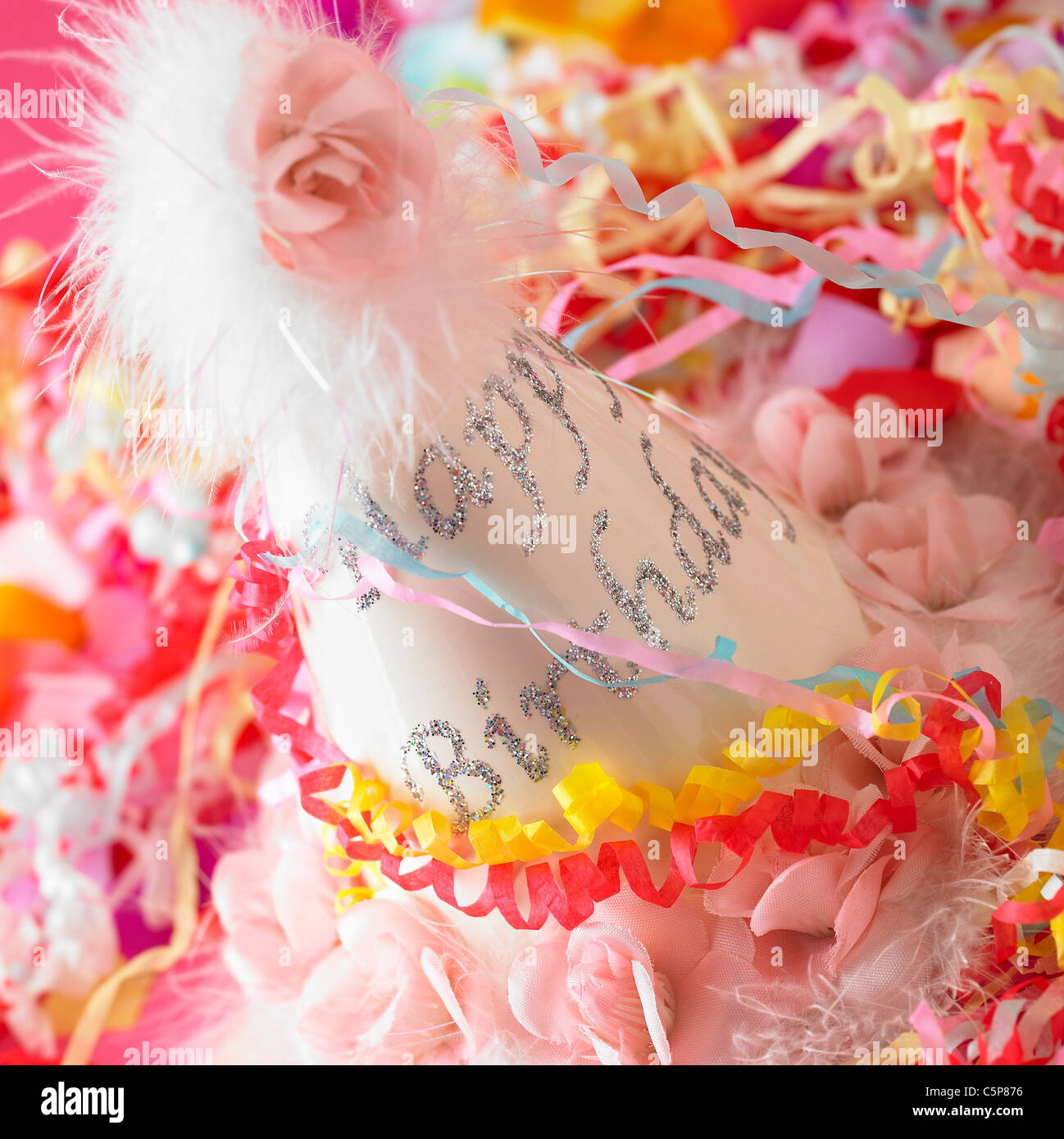 A party hat with many ribbons Stock Photo - Alamy