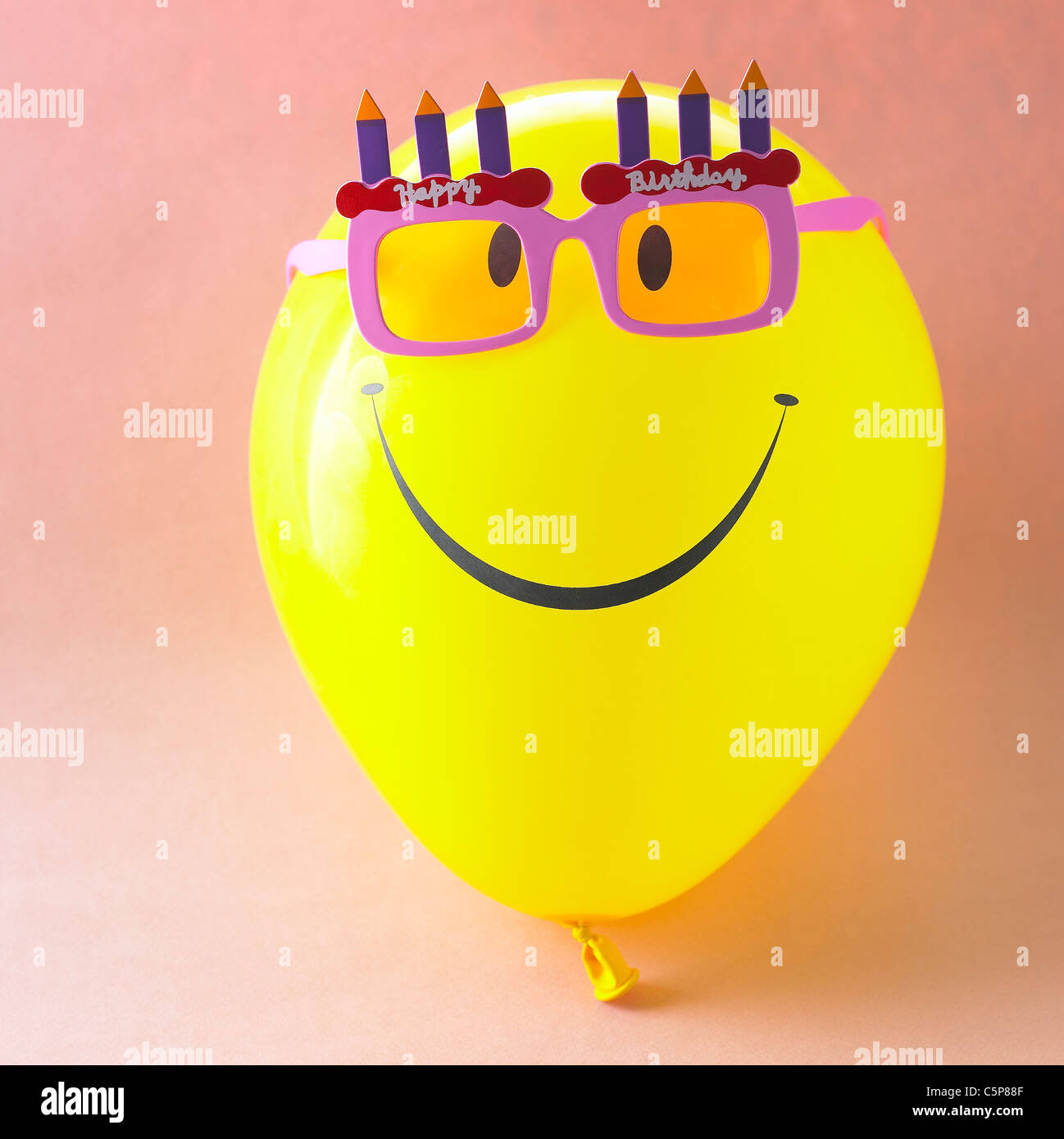 A balloon wearing glasses Stock Photo - Alamy