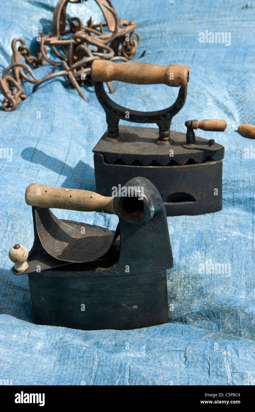 Antiques fair. Old clothes iron Stock Photo - Alamy