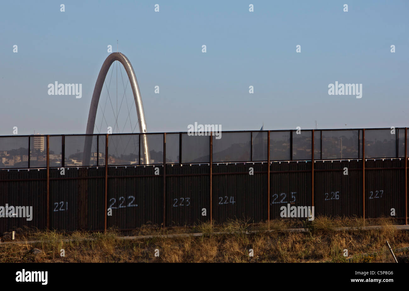 Monument Arch in Tijuana above the Border Fence Stock Photo - Alamy