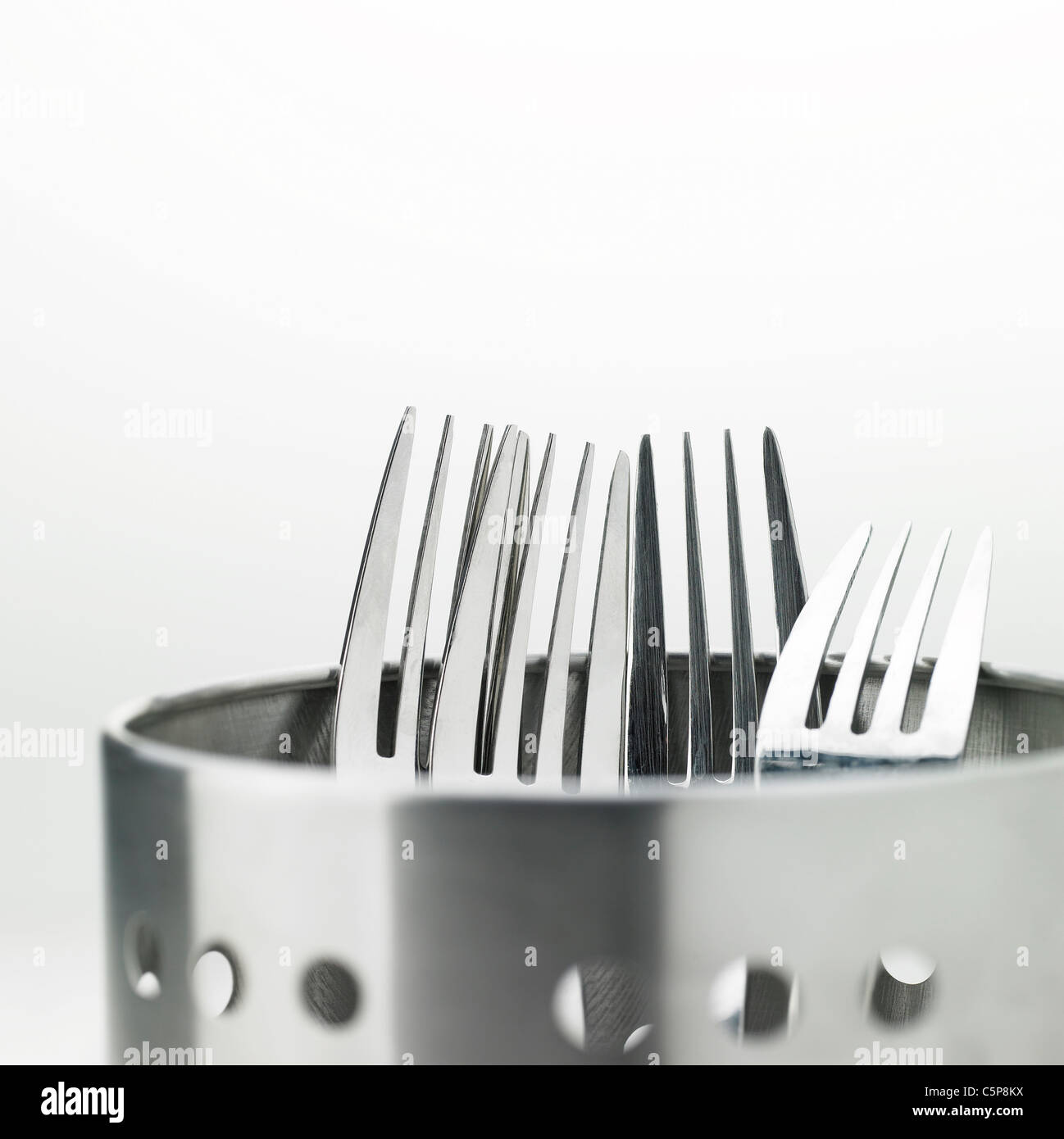 Forks inside a container Stock Photo - Alamy
