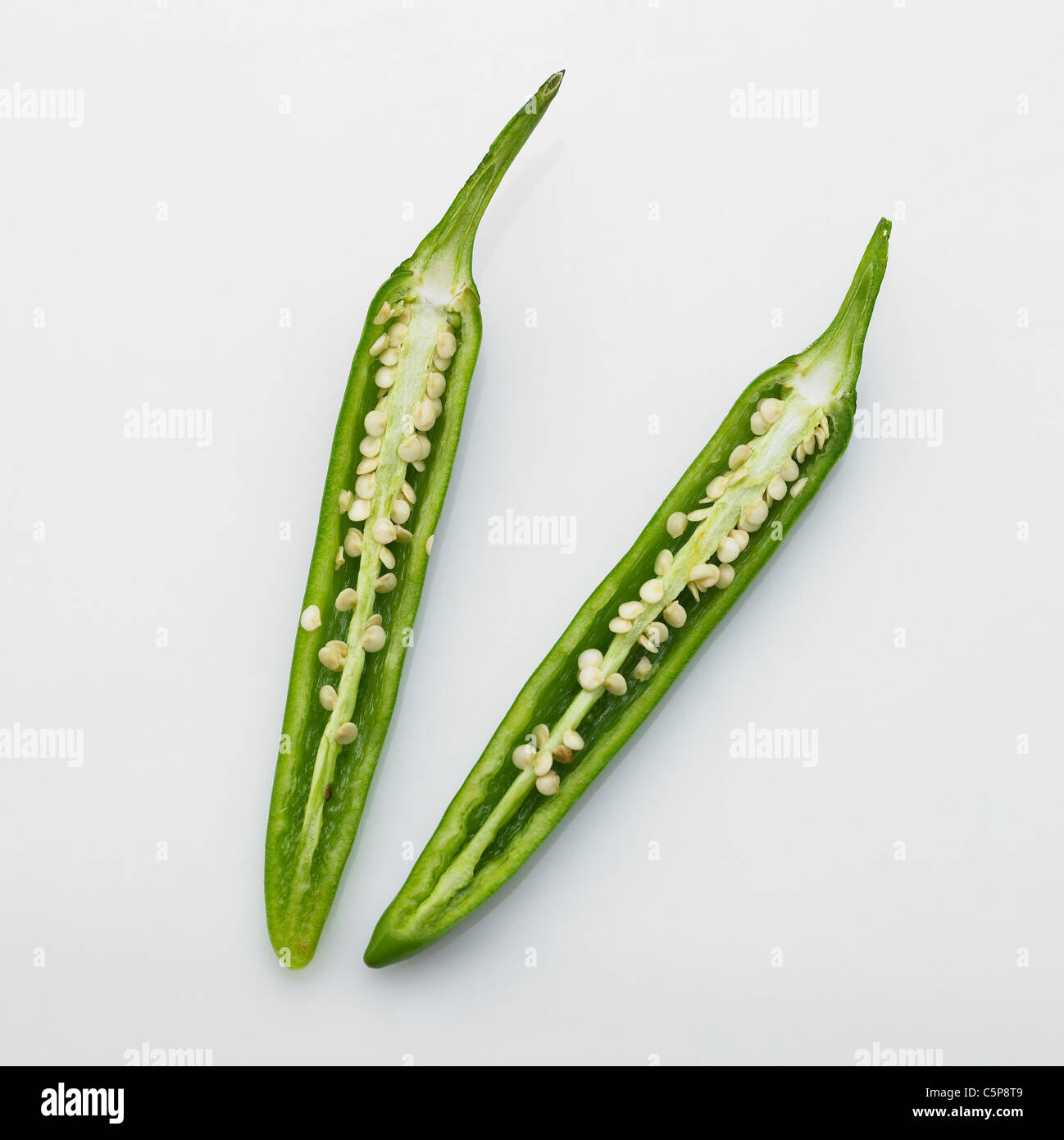 Cross section of green peppers Stock Photo - Alamy