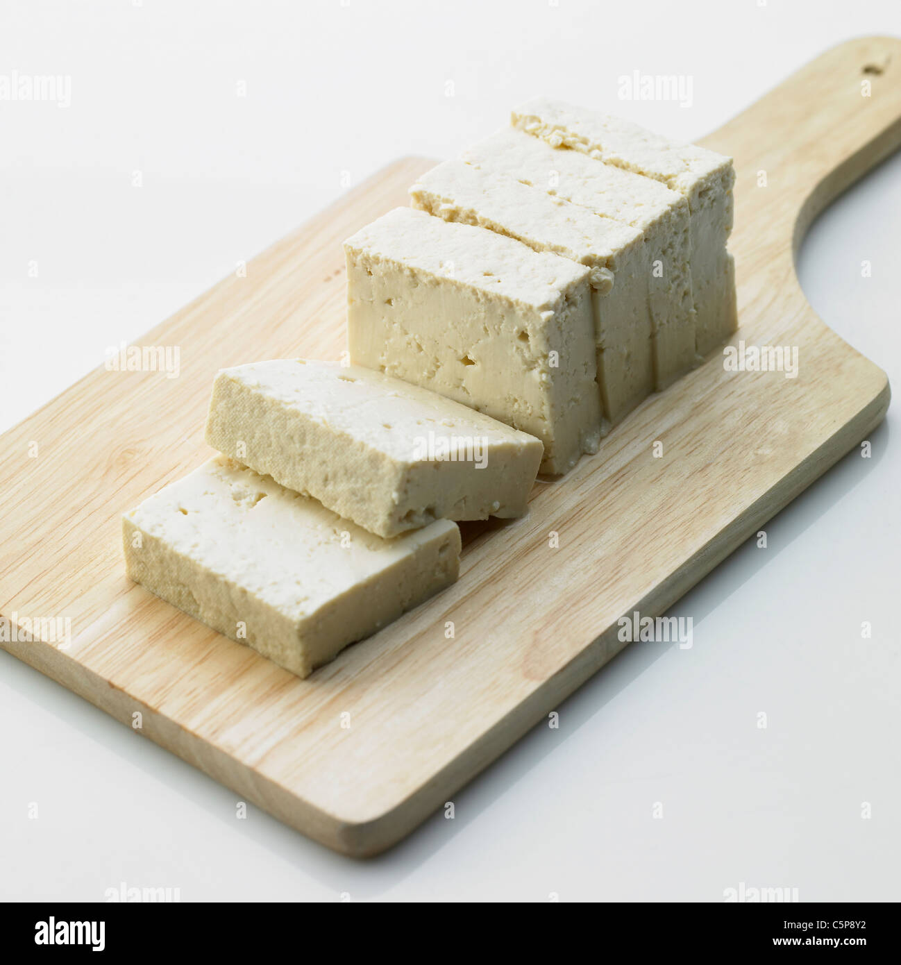 Blocks of tofu on a cutting board Stock Photo - Alamy
