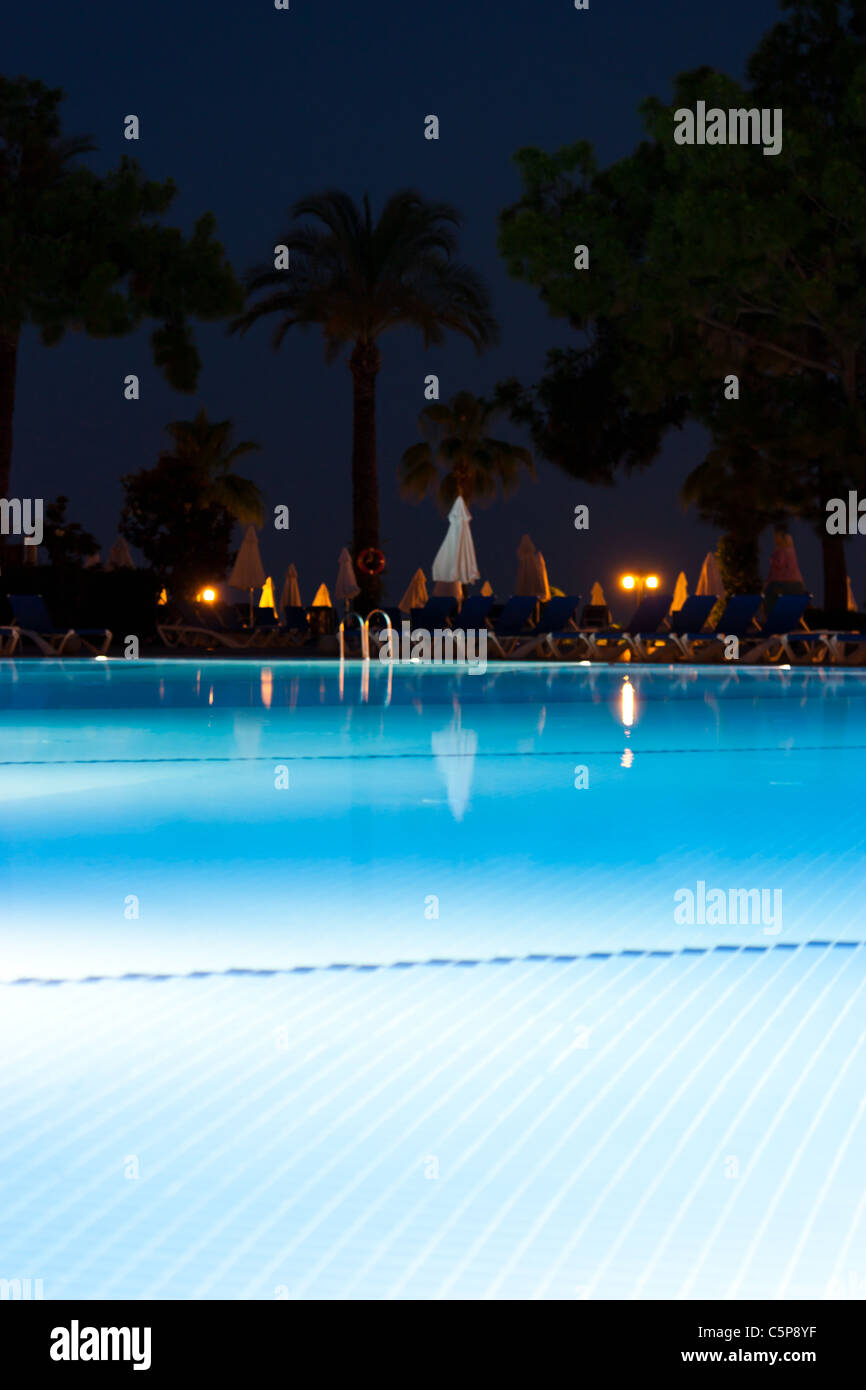 Hotel and resort swimming pool view at night Stock Photo - Alamy
