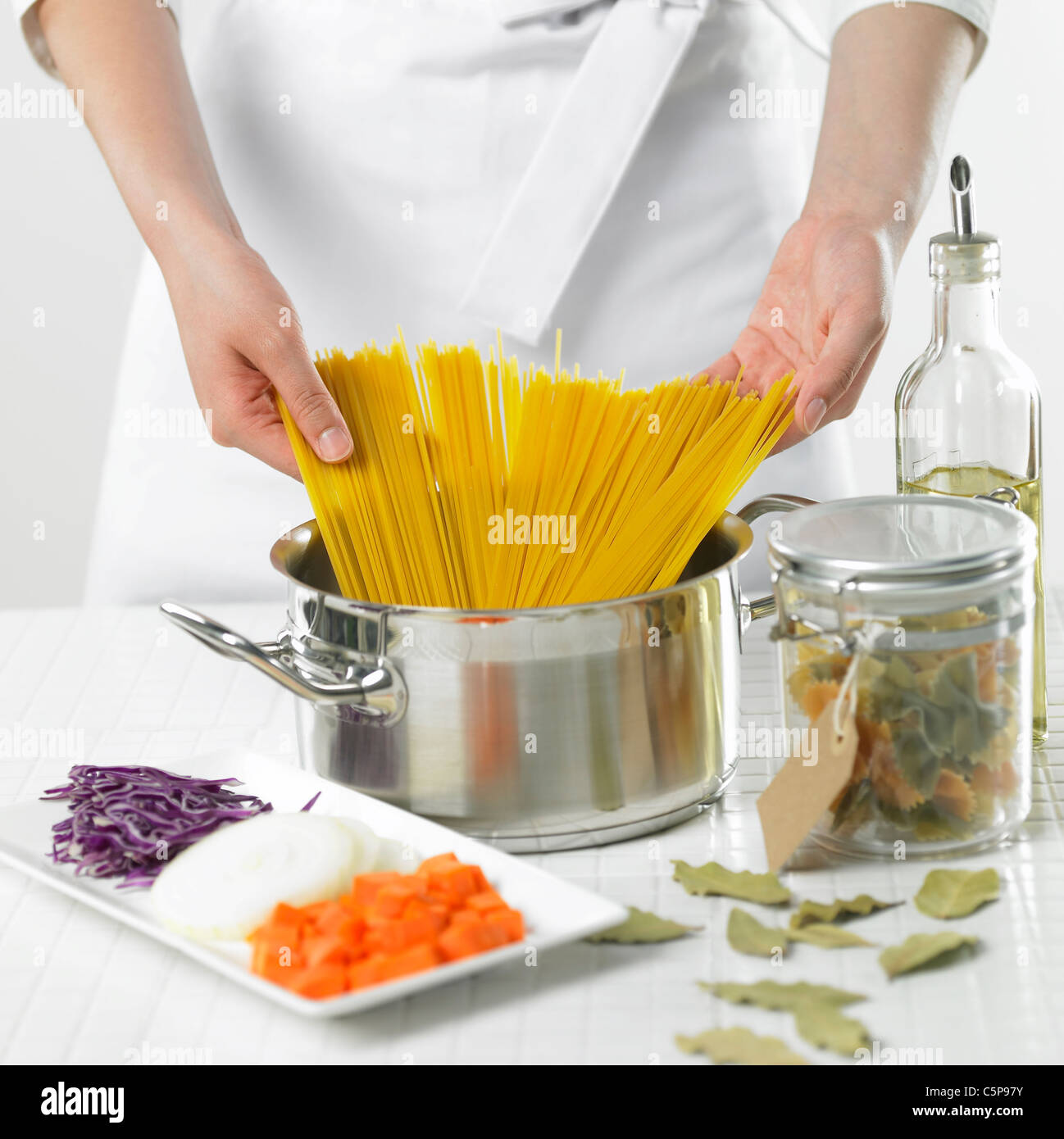 A person preparing pasta Stock Photo - Alamy