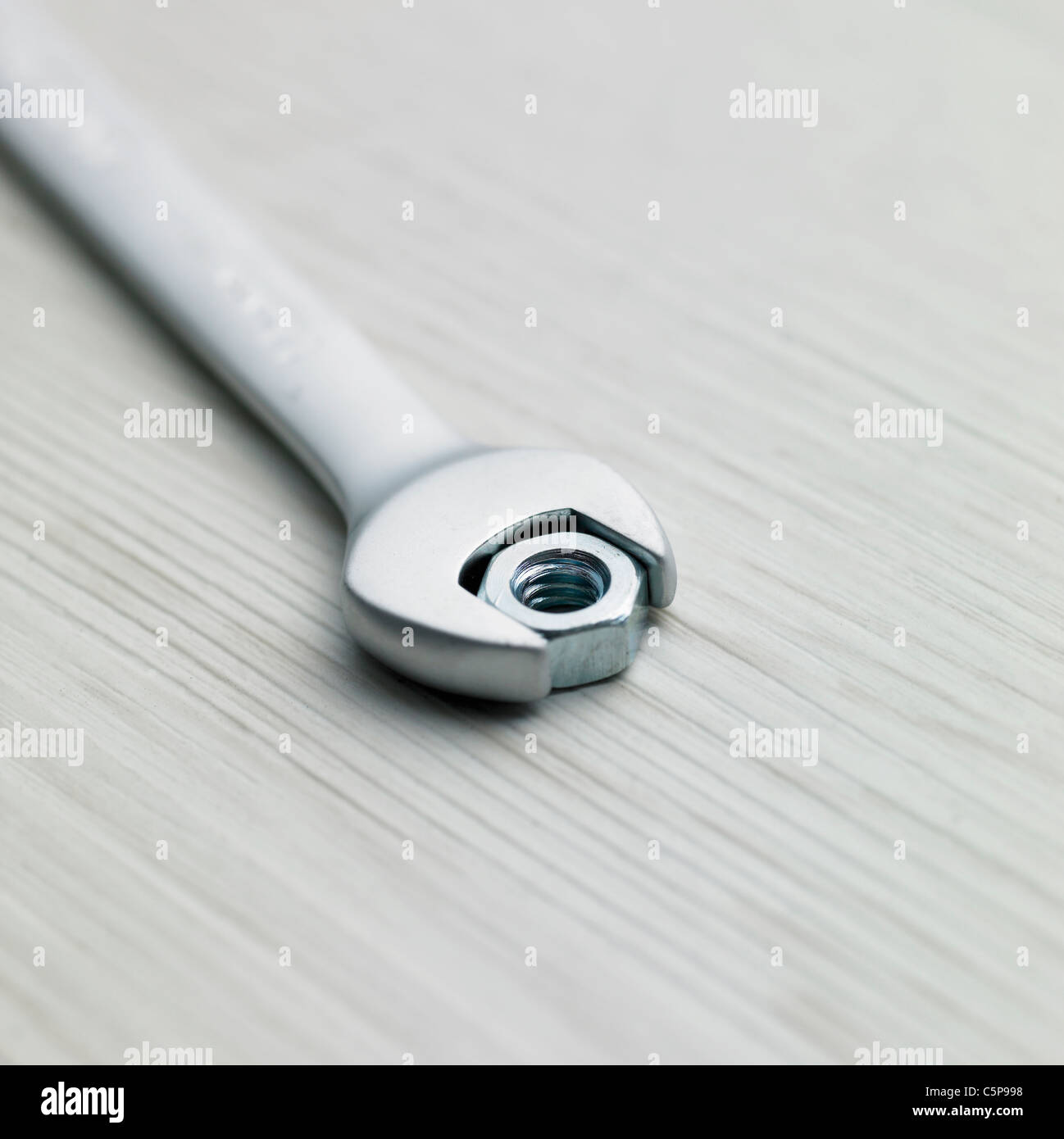 A wrench and a nut Stock Photo - Alamy