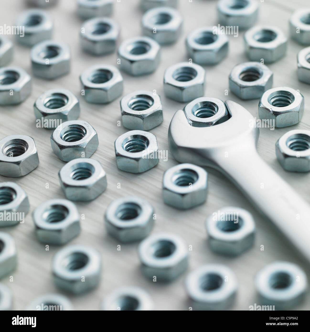 A spanner and nuts Stock Photo - Alamy
