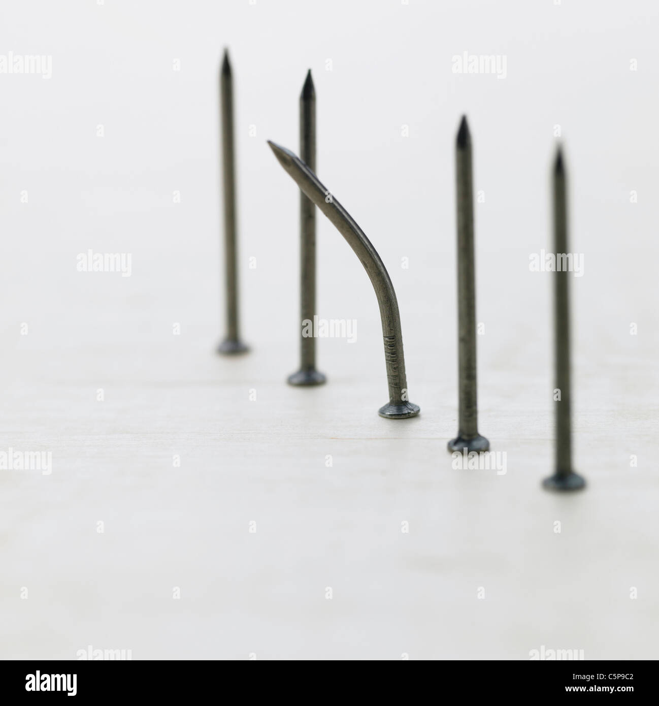 Nails in a row Stock Photo - Alamy