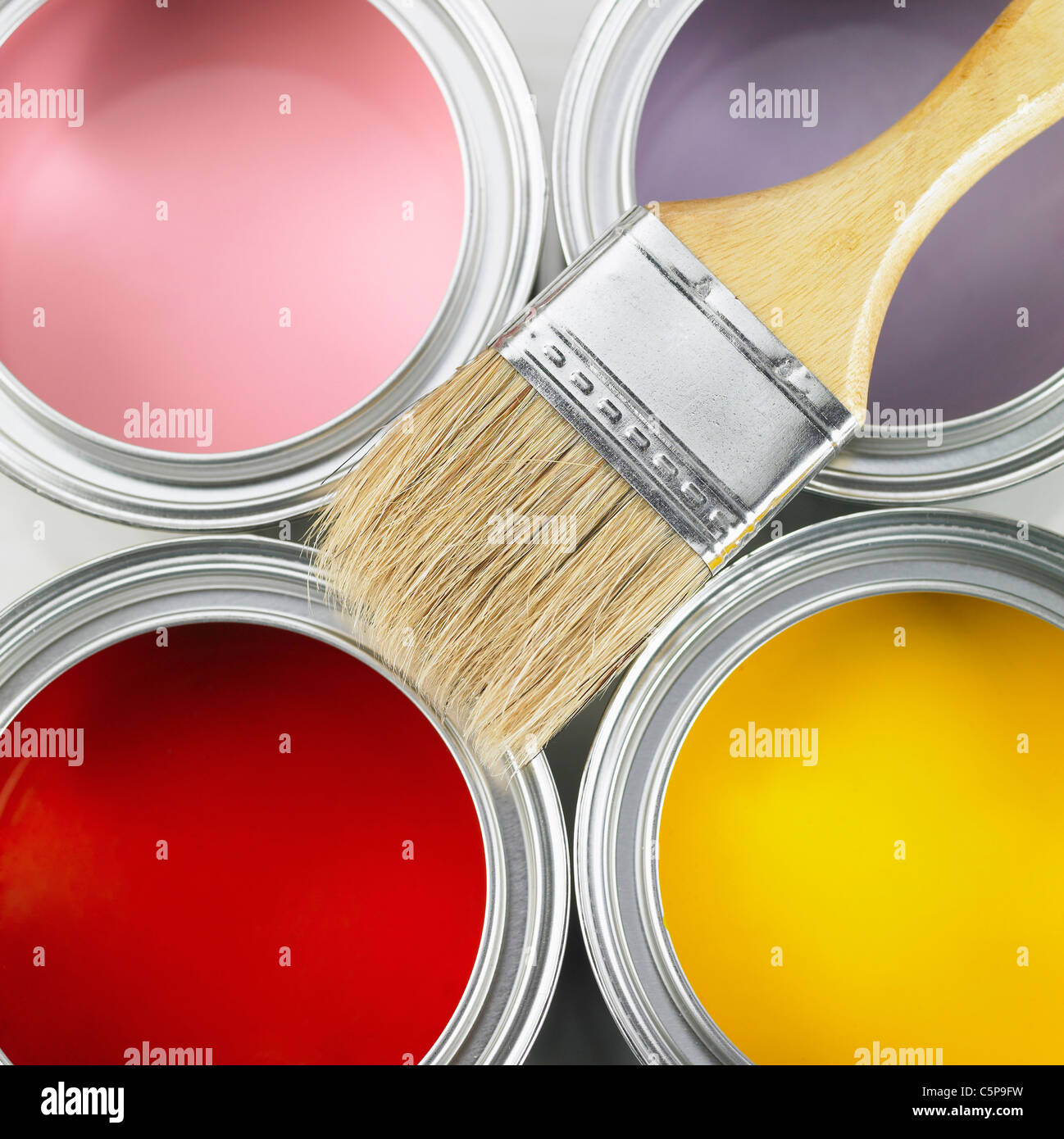 Paint colors and a paint brush Stock Photo - Alamy