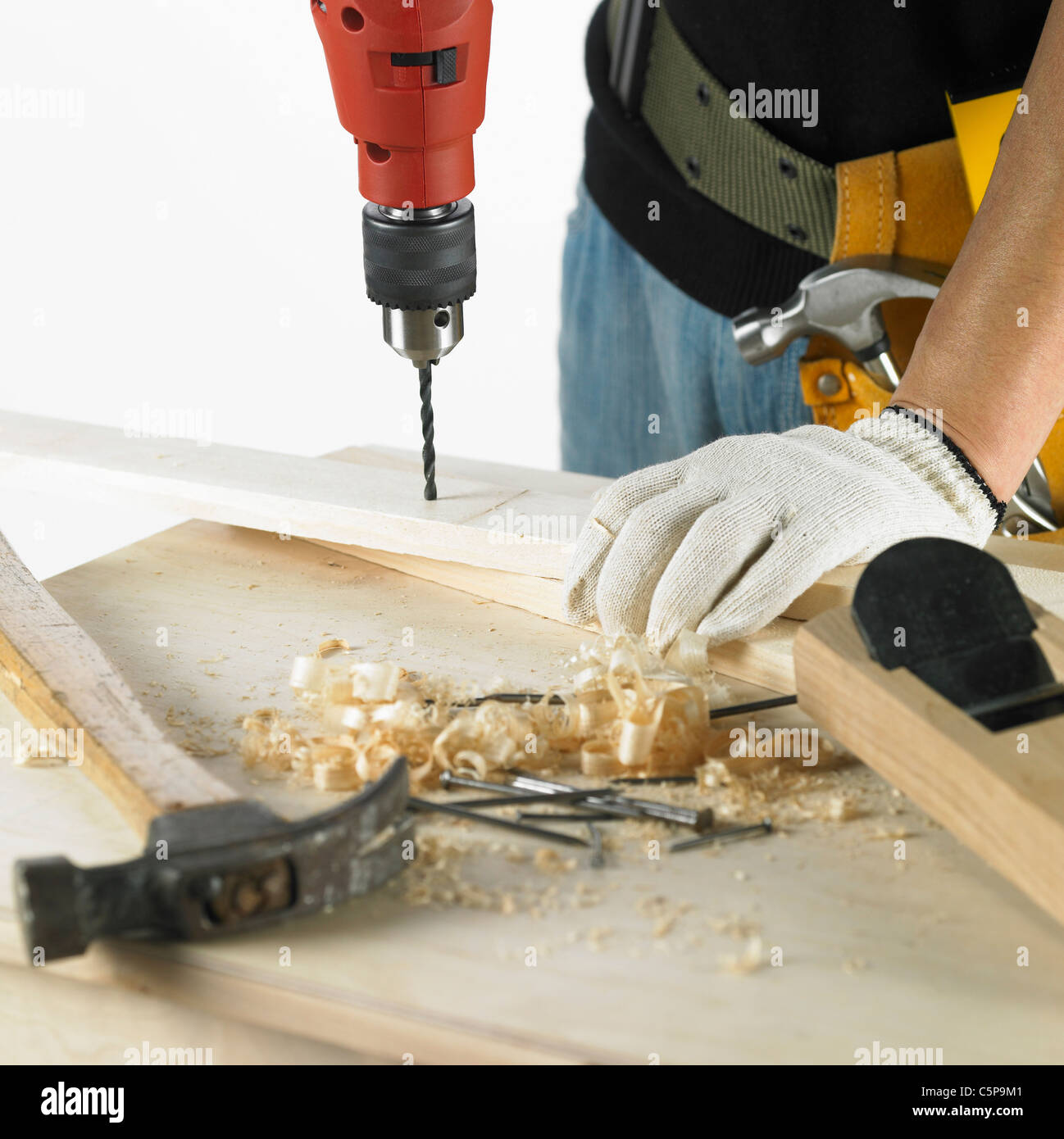 A person drilling a wood piece Stock Photo - Alamy