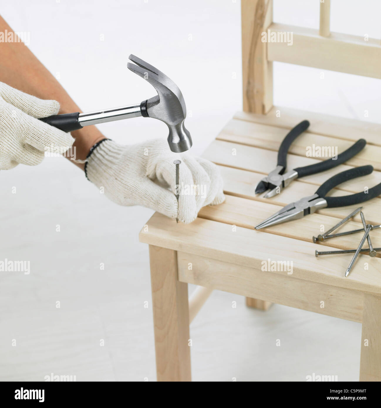 A person hammering Stock Photo - Alamy