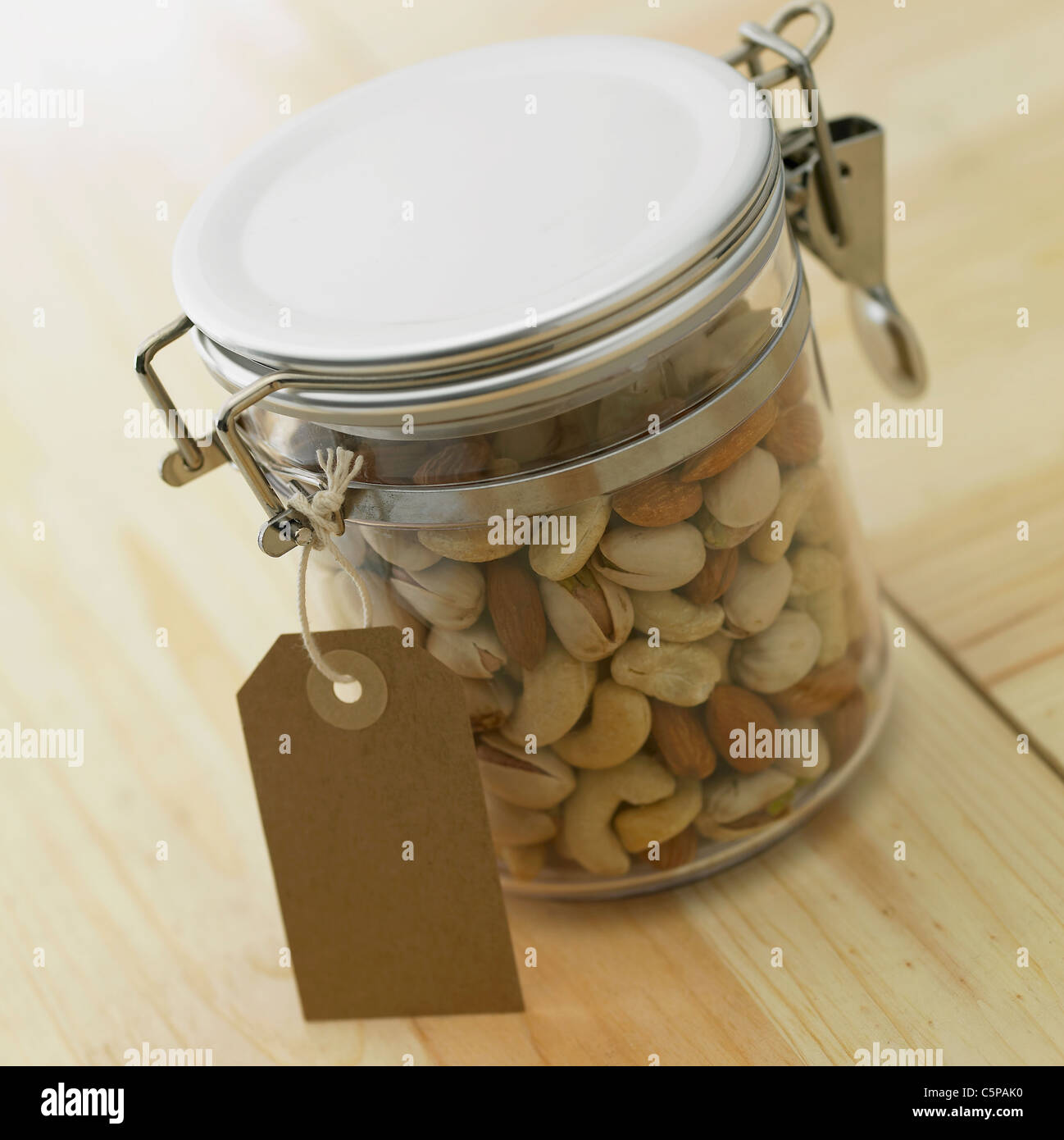 Nuts in a container Stock Photo - Alamy