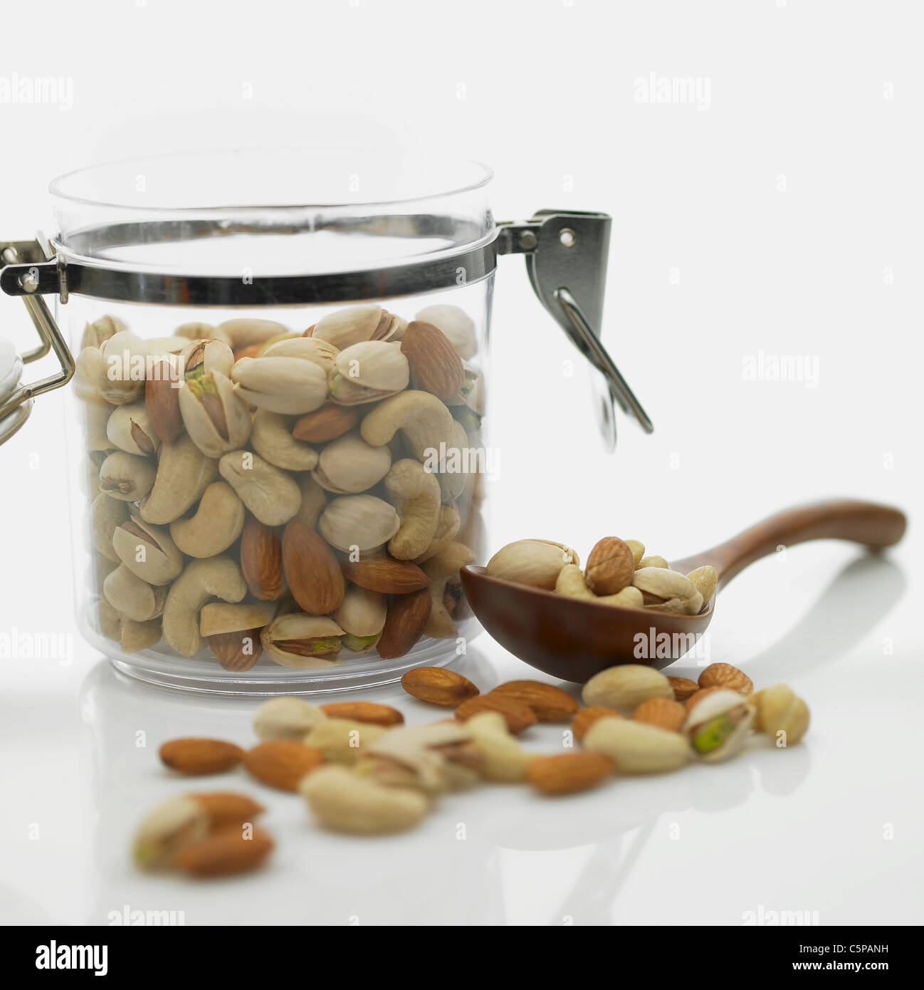 Nuts with container Stock Photo - Alamy