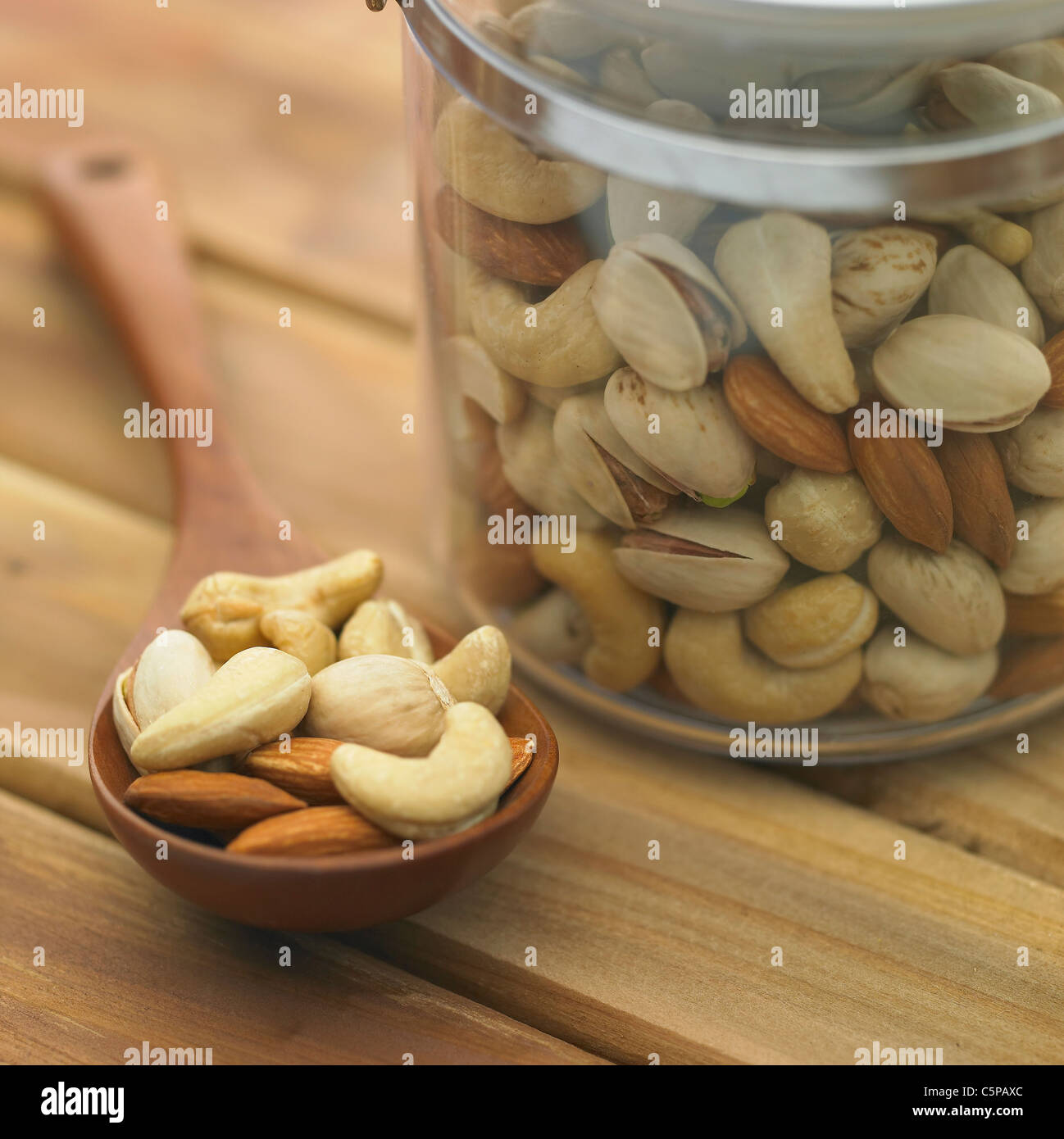 Nuts with container Stock Photo - Alamy