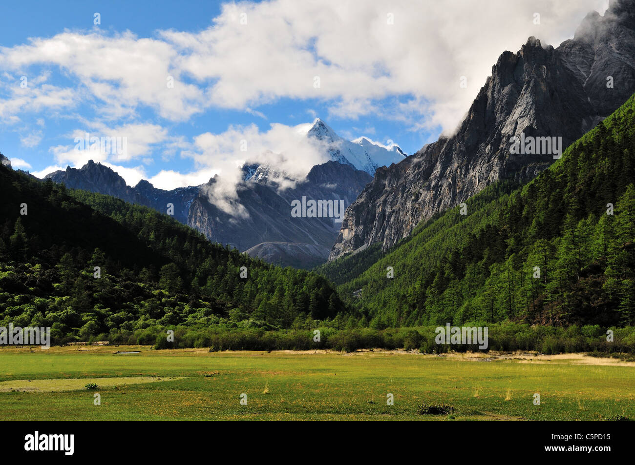 View of Xianuoduoji (Chanadorje) from green meadow of Chonggu Monastery ...