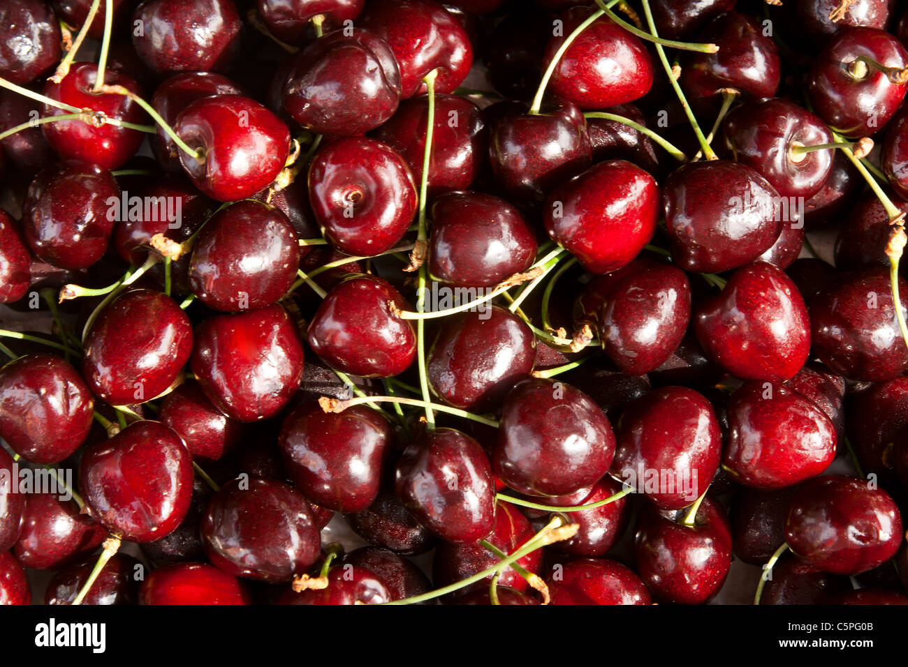 background of ripe black cherry delicious Stock Photo - Alamy