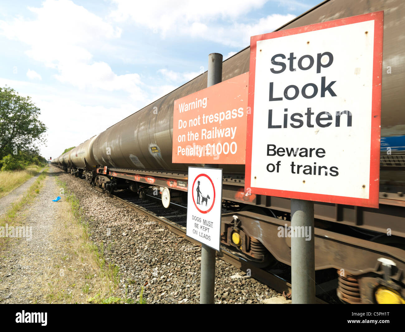 Signs at railway crossing Stock Photo - Alamy