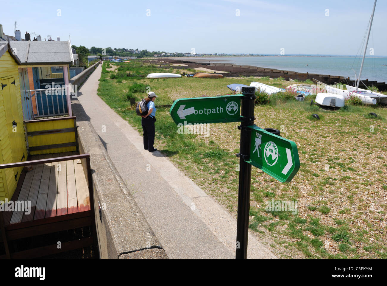 A walker surveys the seafront Stock Photo - Alamy