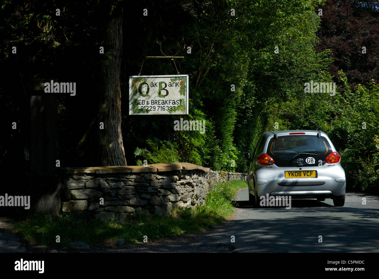 Car passing sign for Oak Bank B & B, Duddon valley, Lake District ...
