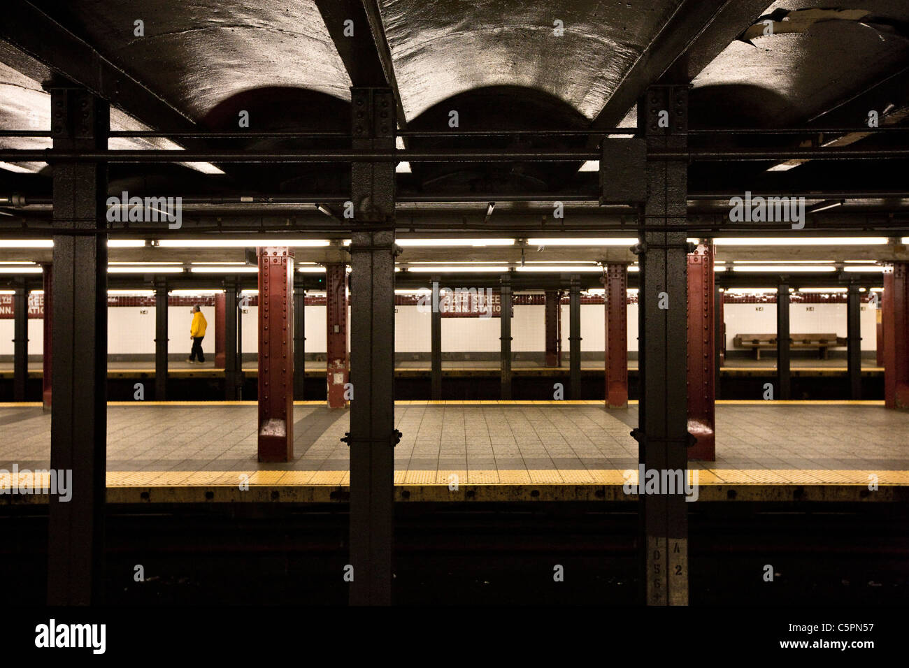 Lone commuter on New York City subway platform at Penn Station ...