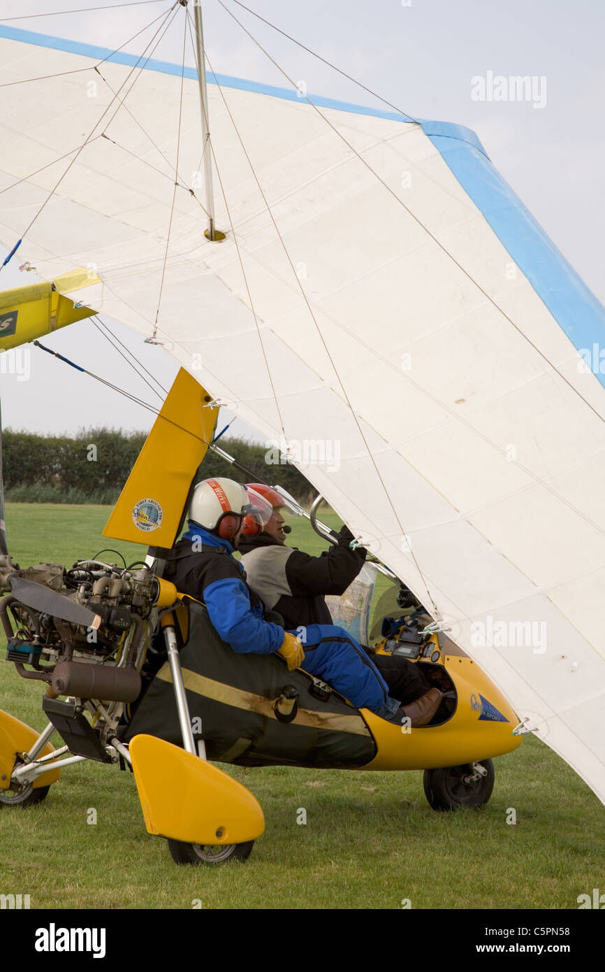 Microlight pilot getting ready to take a passenger for a lesson Stock ...