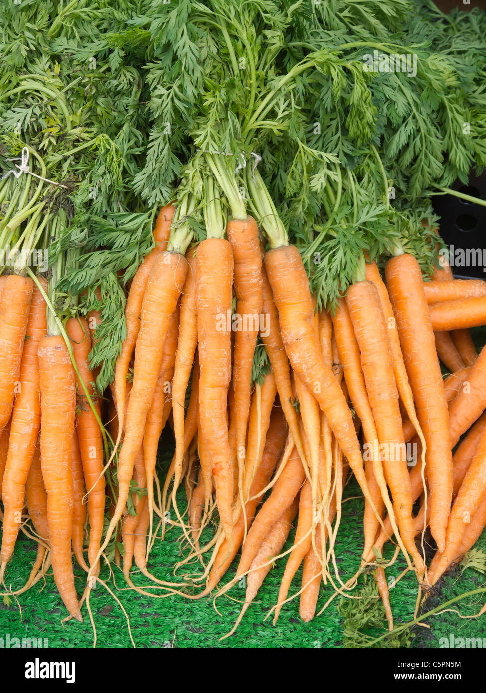 Fresh locally grown carrots on a market stall in Helmsley North ...