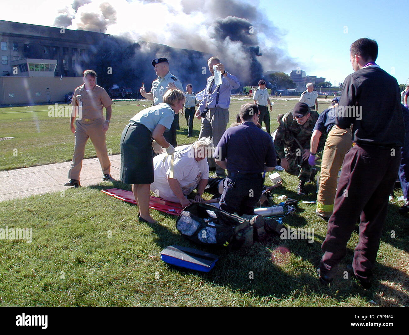 Emergency workers help the wounded following the terrorist attacks of ...