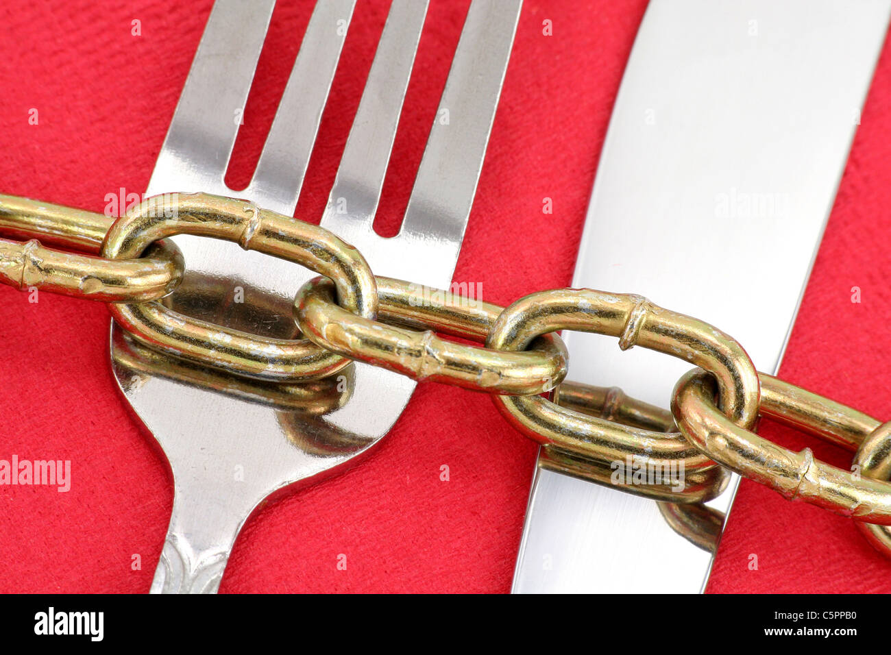 chain and fork with white background, concept of diet Stock Photo - Alamy