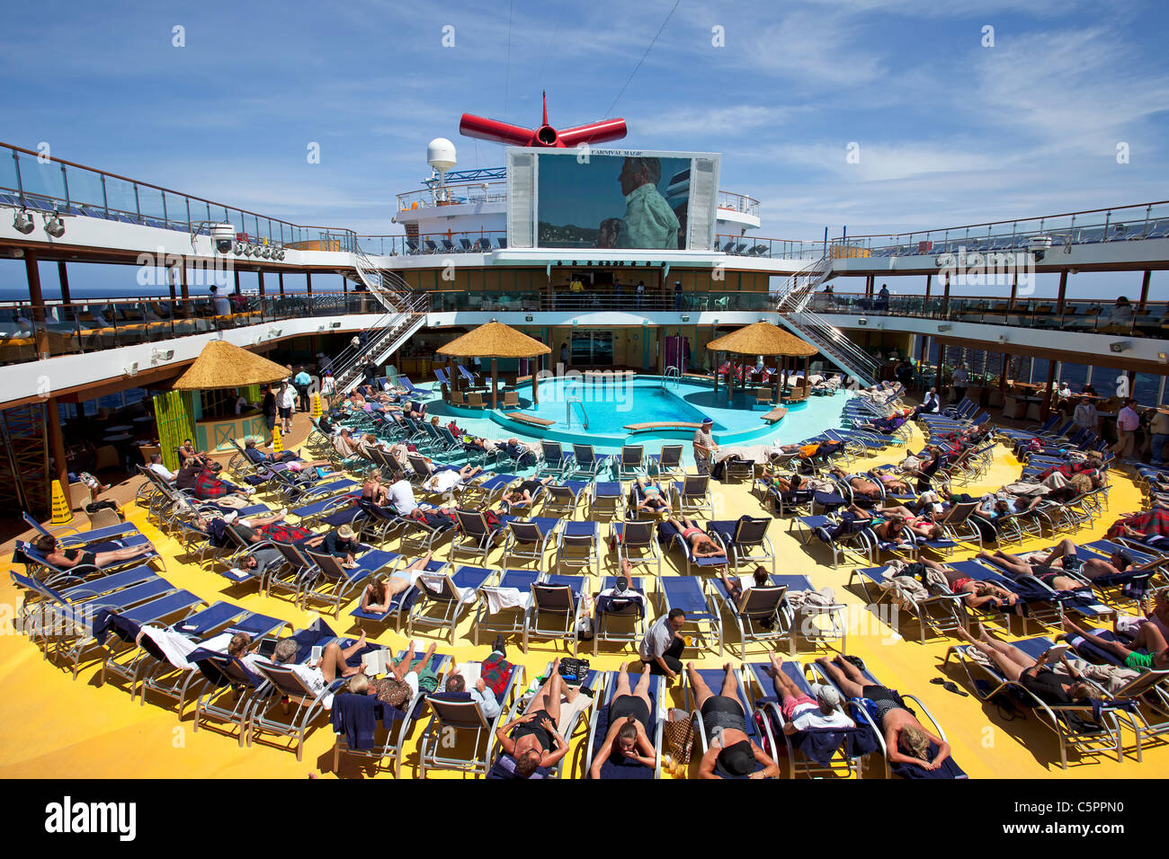 Cruise ship outdoor swimming pool, sun deck and swimming pool ...