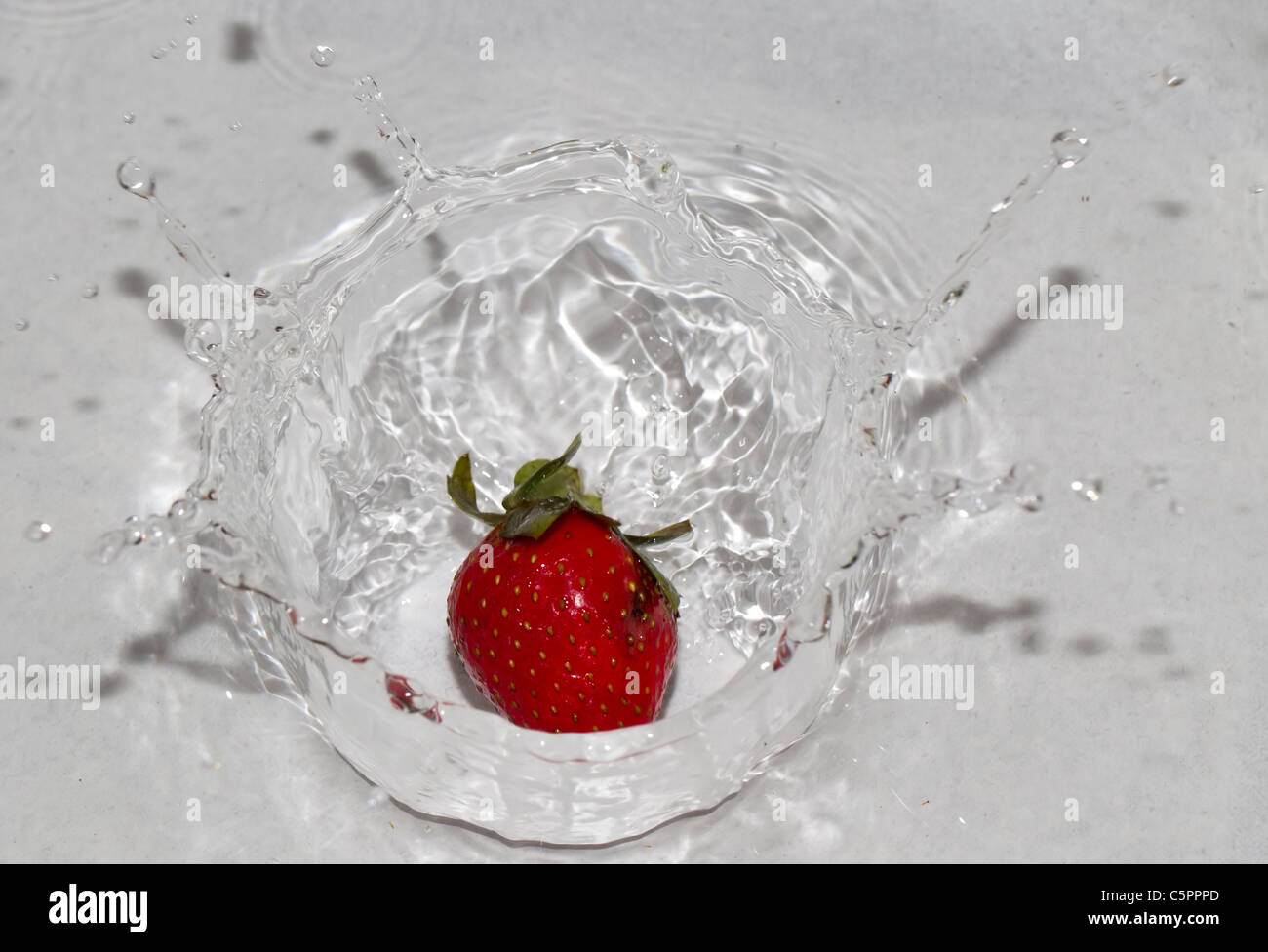 Strawberry in water Stock Photo - Alamy