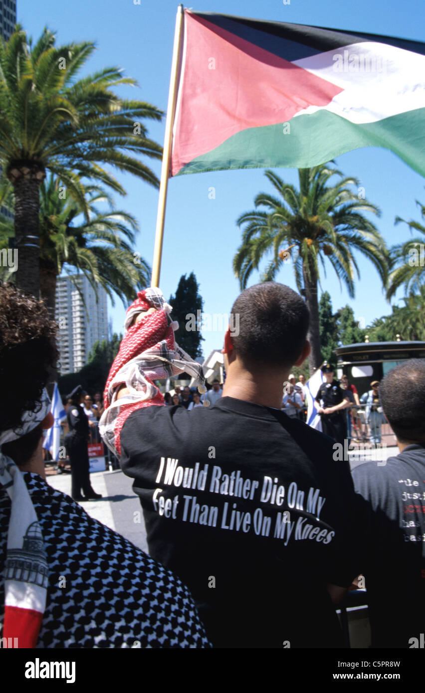 Palestinian man waves Palestine flag at anti Israel bombing of Gaza ...