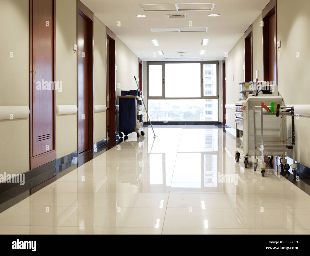 Interior of clean reflective empty hallway of hospital Stock Photo - Alamy